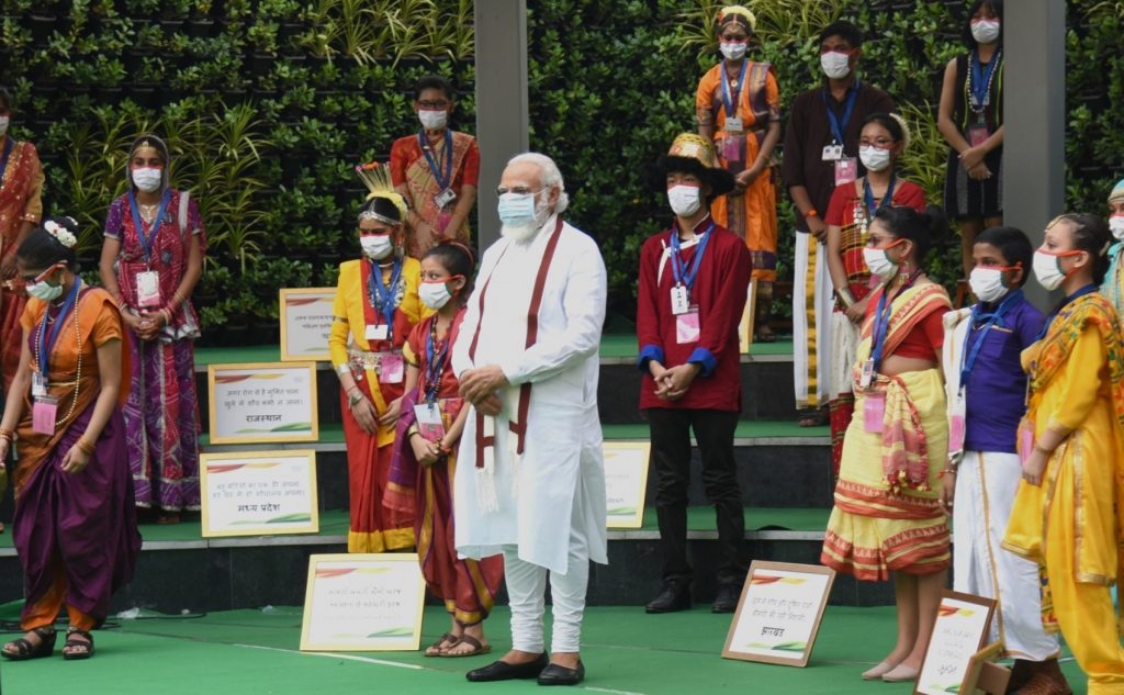 Prime Minister Narendra Modi poses for photographs with school children ...